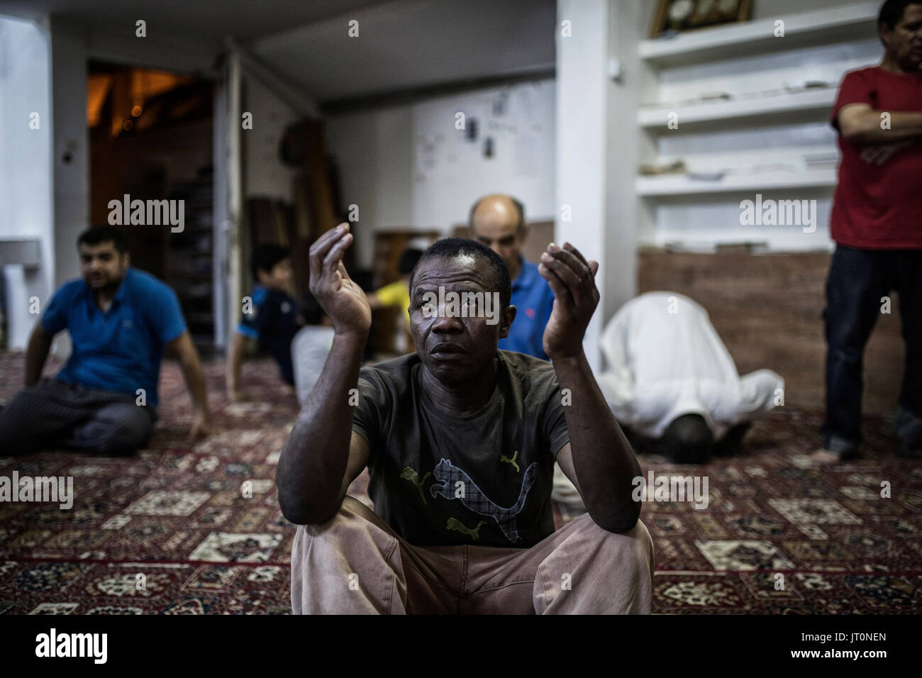 Athens, Greece. 6th July, 2017. A Muslim is praying in a provisonal ...
