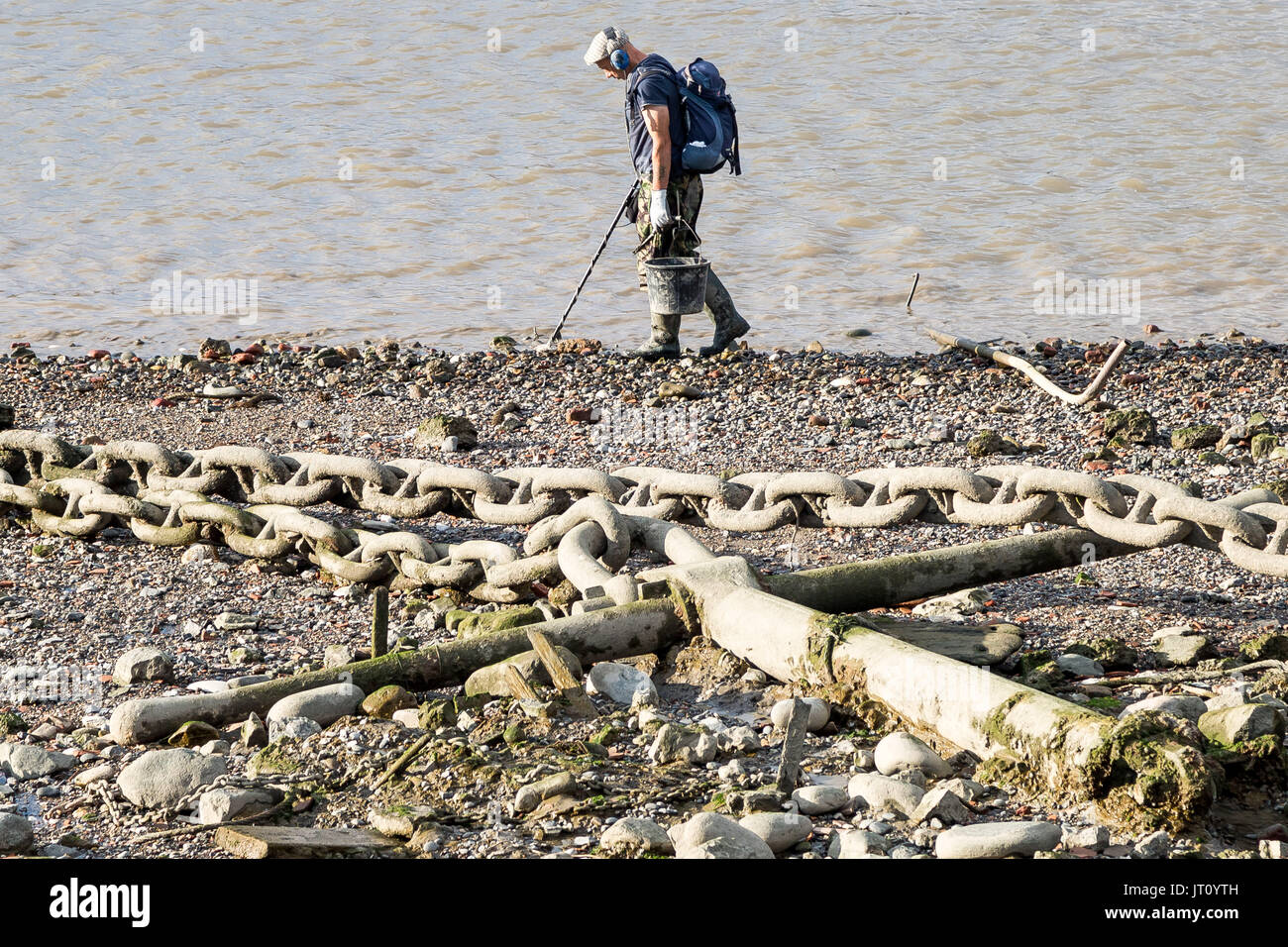 London, UK. 7th August, 2017. An afternoon mudlarker scans the River ...