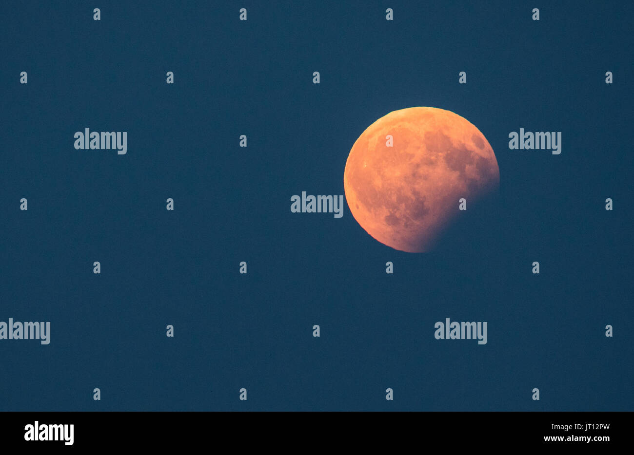 Berlin, Germany. 07th Aug, 2017. Glance at a partial moon eclipse in Berlin, Germany, 07 August ...