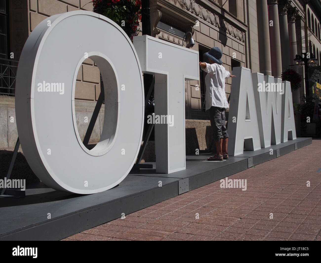 Woman posing as a "T" as part of the word "OTTAWA" spelled out in giant ...