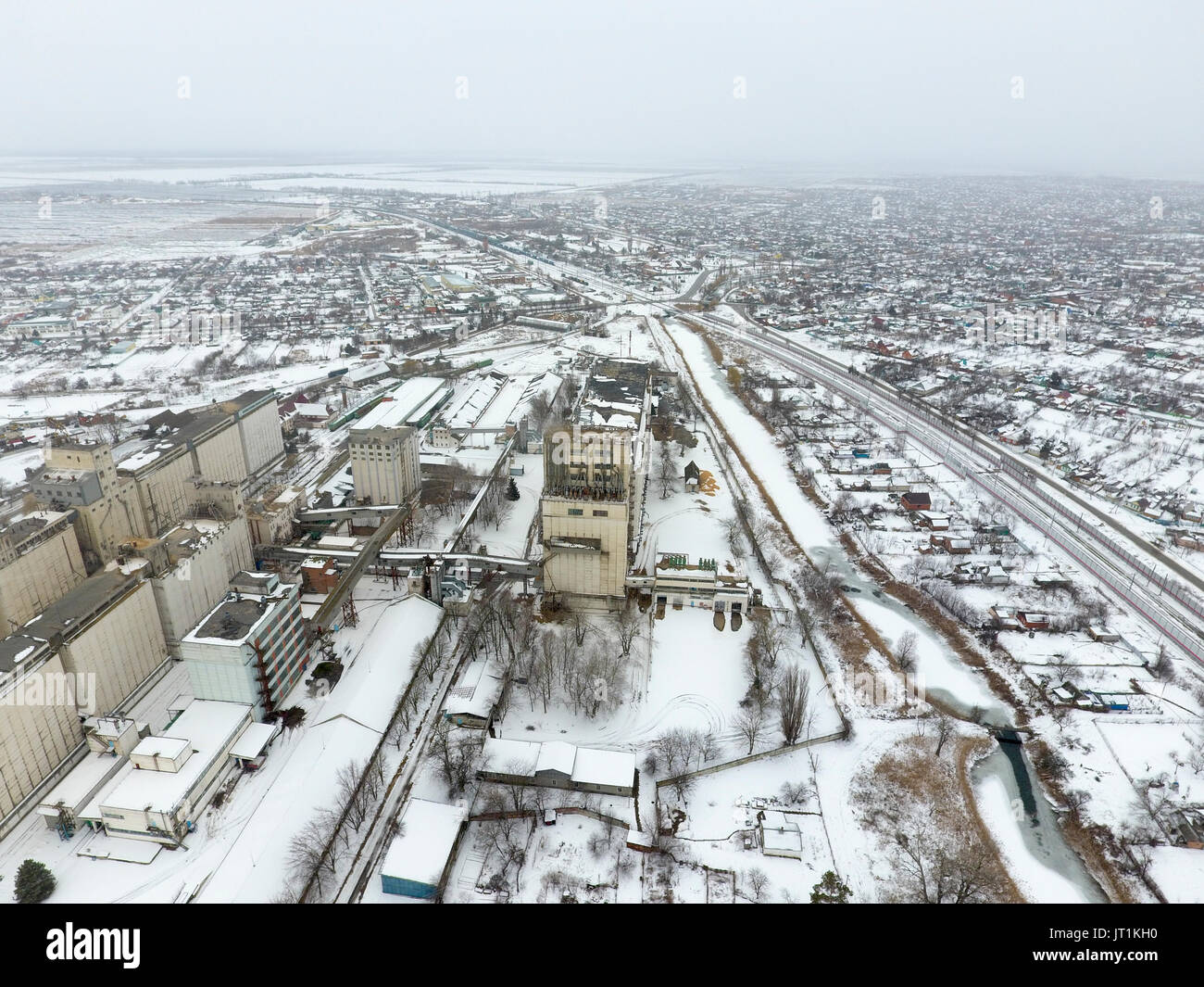 Sprinkled with snow grain elevator. Winter view of the old Soviet ...