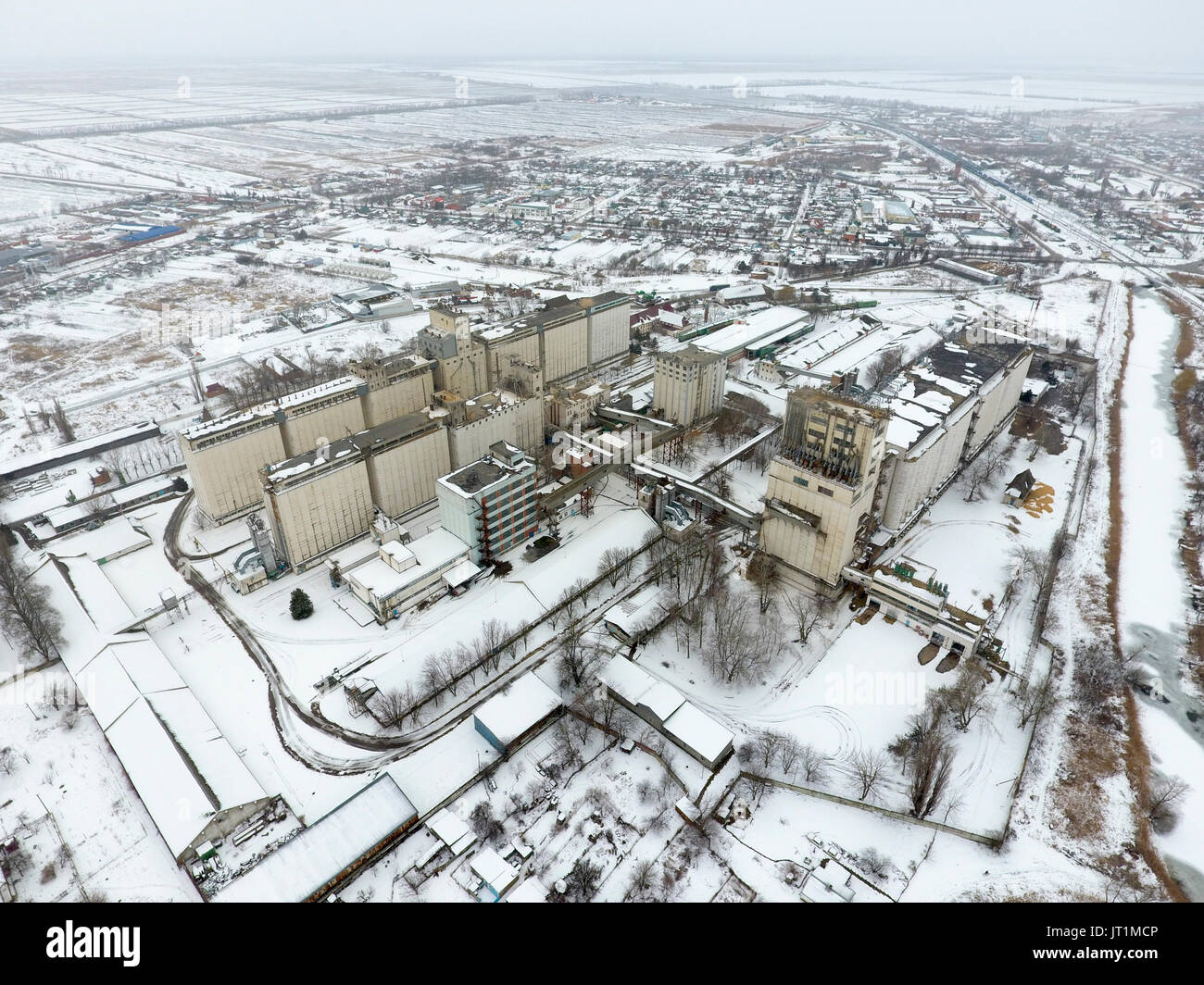Sprinkled with snow grain elevator. Winter view of the old Soviet ...