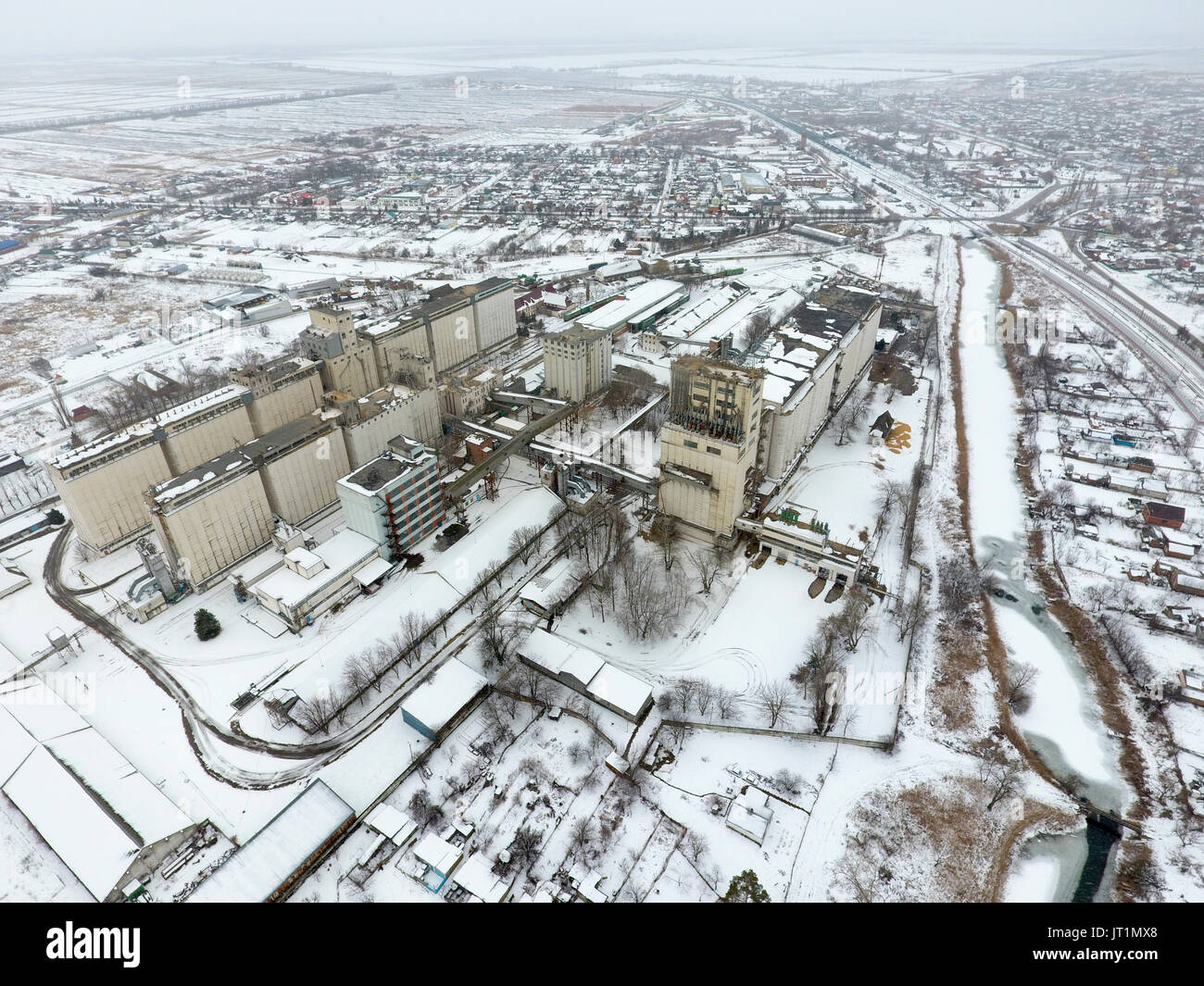 Sprinkled with snow grain elevator. Winter view of the old Soviet ...