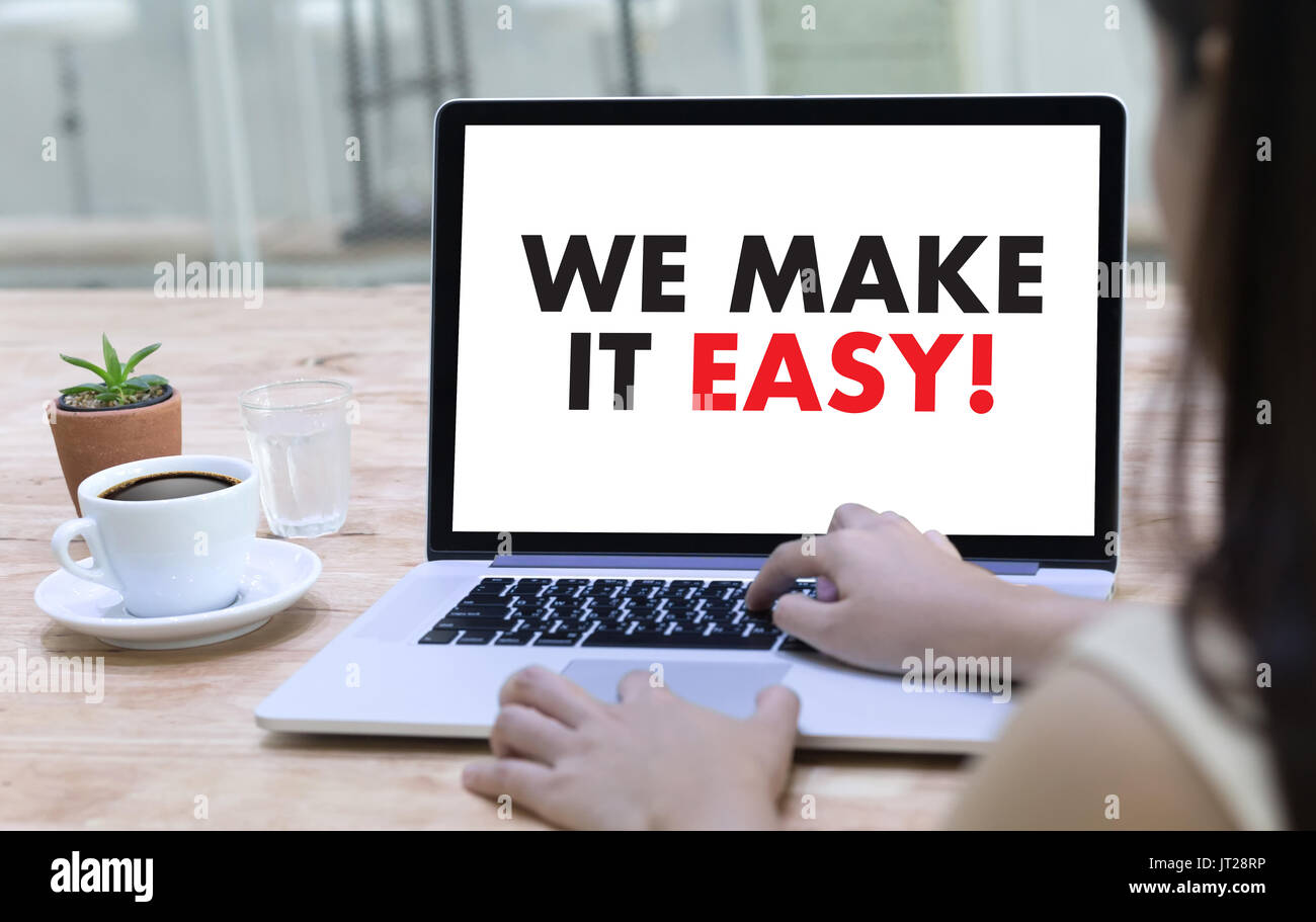 WE MAKE IT EASY! Business team hands at work with financial reports and ...