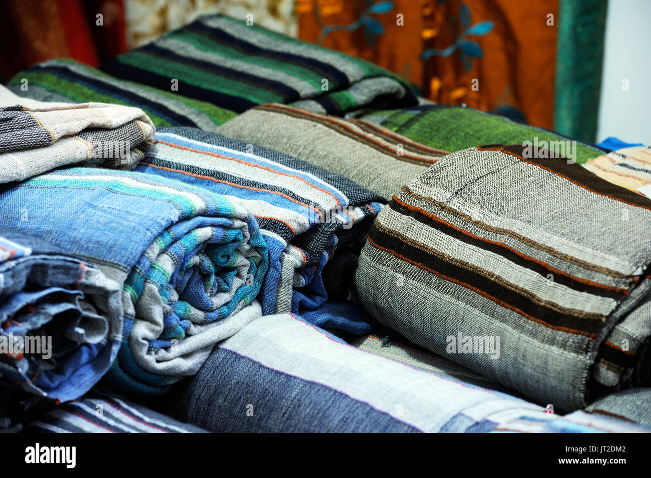 Rolls of colorful fabric as a vibrant background image Stock Photo - Alamy