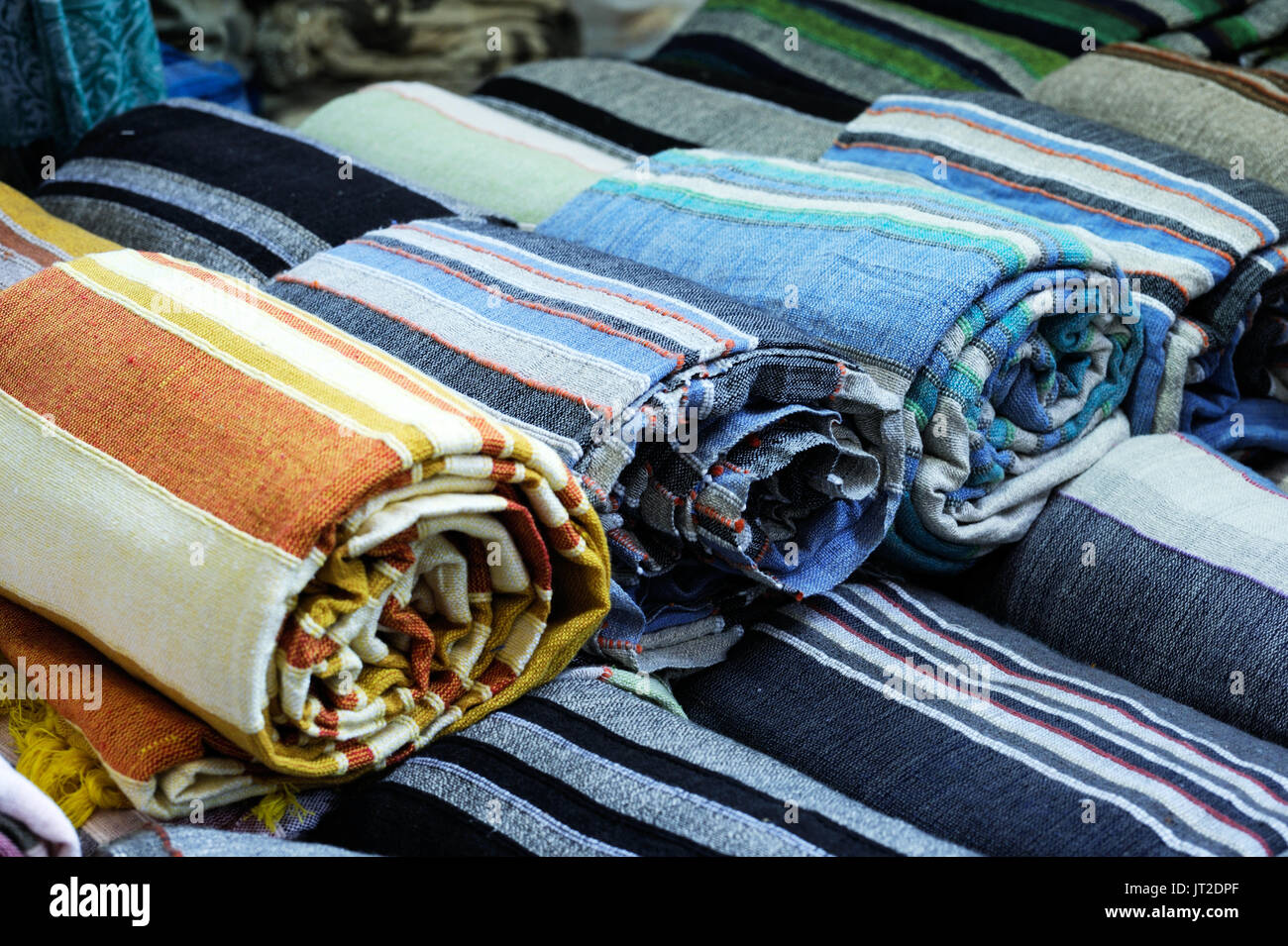 Rolls of colorful fabric as a vibrant background image Stock Photo - Alamy