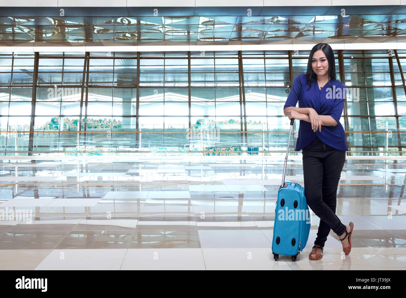 Airport terminal portrait smiling woman hi-res stock photography and ...