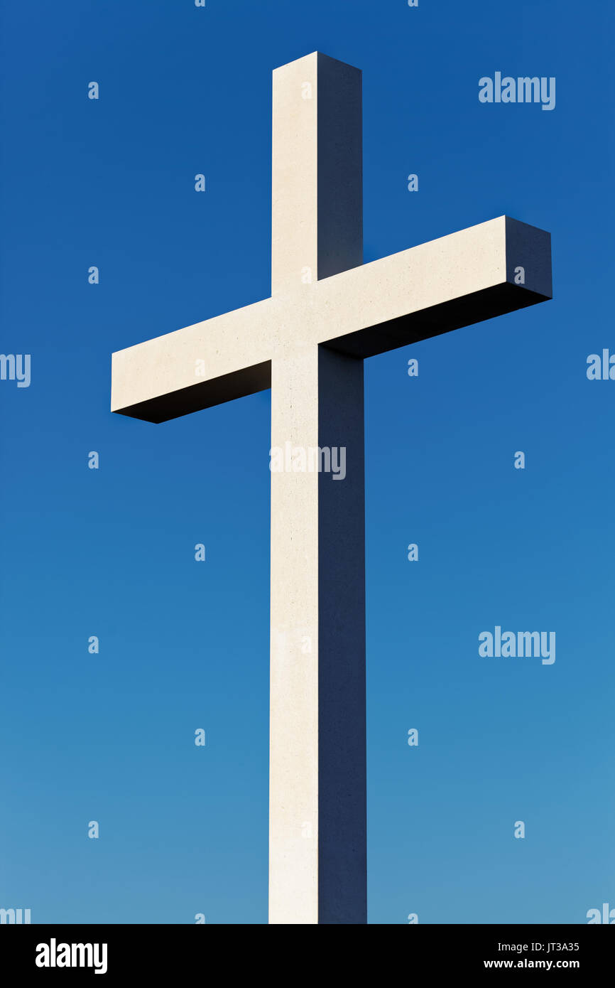 Cross as a symbol of Christianity with clear blue sky on background ...