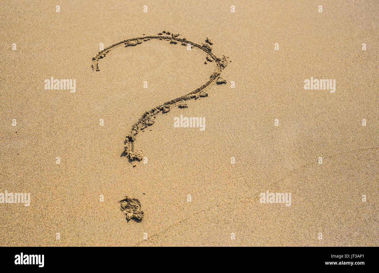 question mark drawn on the sand of a beach in summer Stock Photo - Alamy