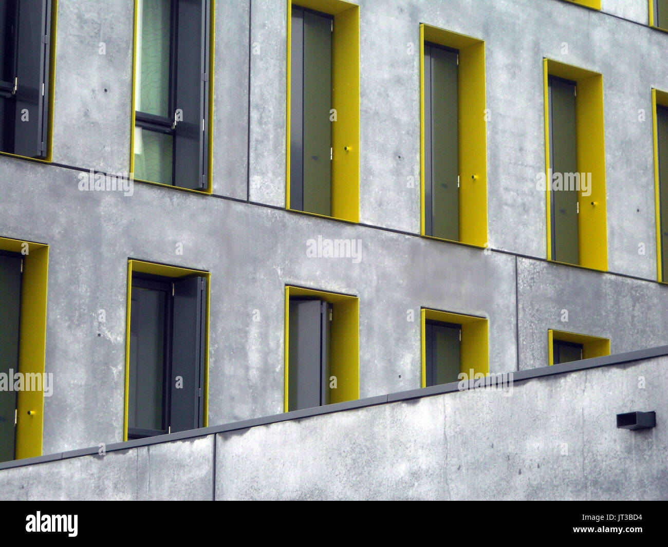 concrete facade with yellow reveals Stock Photo - Alamy