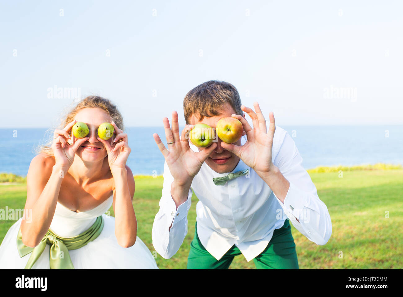 April fools day concept - Young wedding couple funny portrait with ...