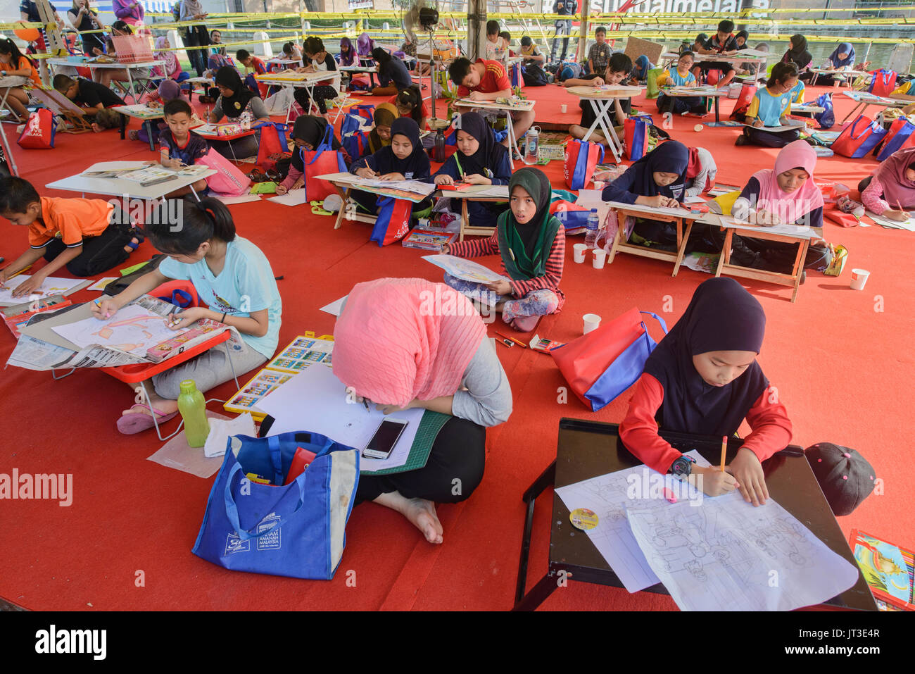 Girls drawing artwork, Malacca, Malaysia Stock Photo - Alamy