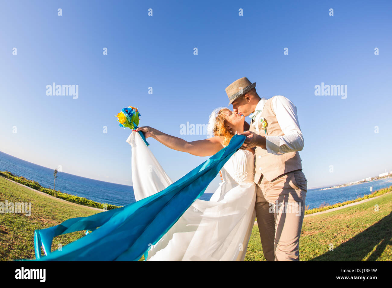 Bride and Groom have fun in their wedding day Stock Photo - Alamy