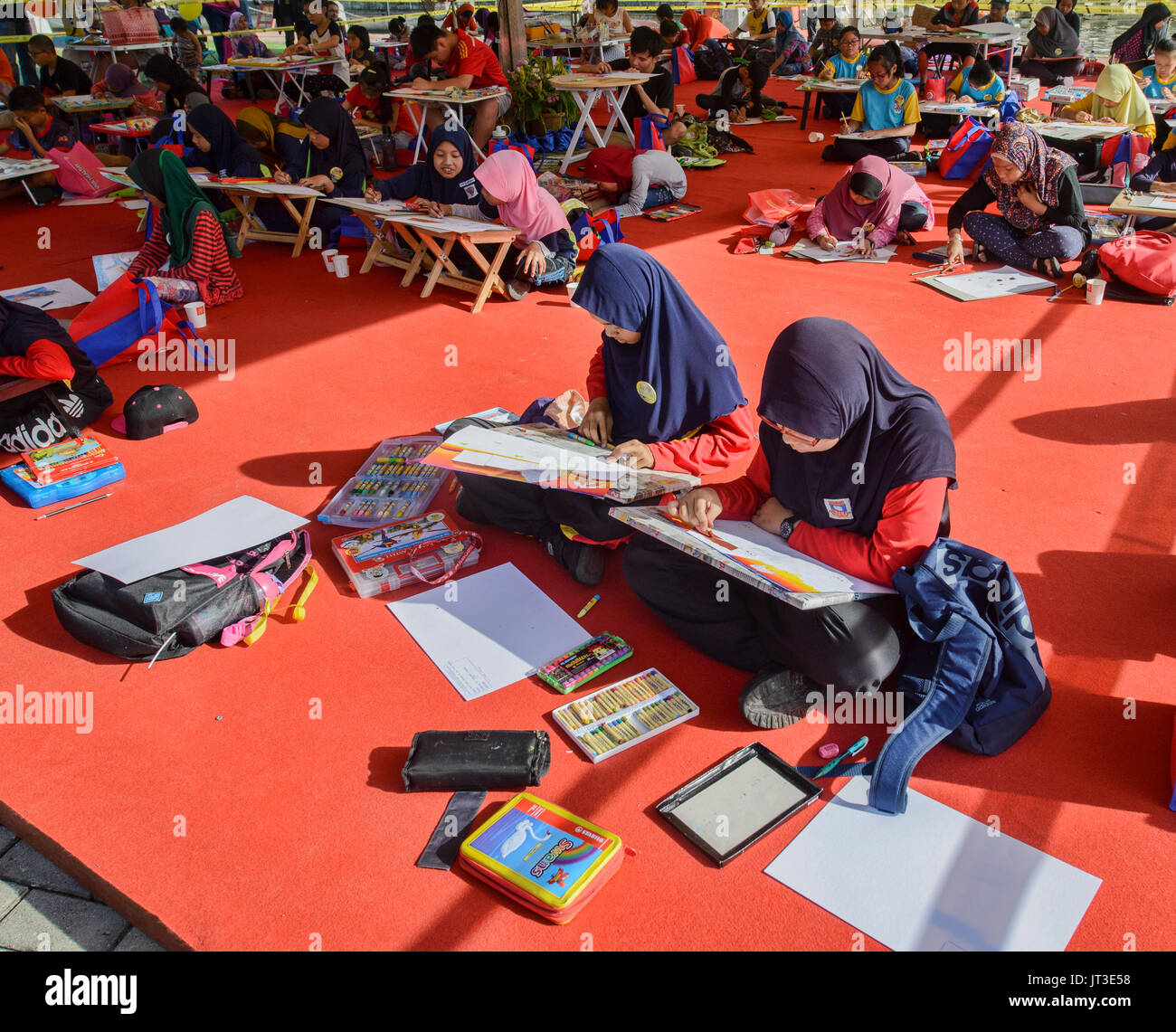 Girls drawing artwork, Malacca, Malaysia Stock Photo - Alamy