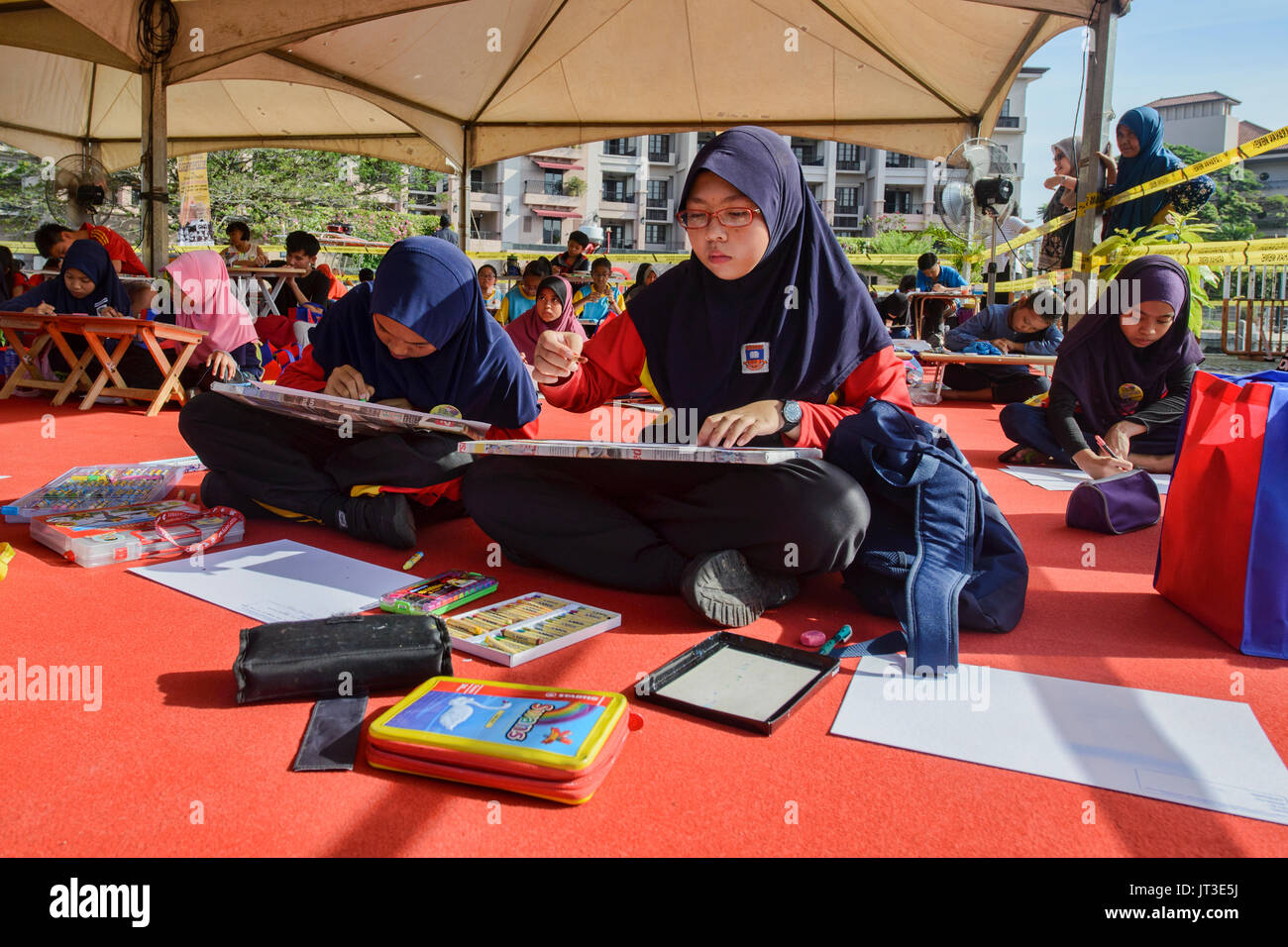 Girls drawing artwork, Malacca, Malaysia Stock Photo - Alamy