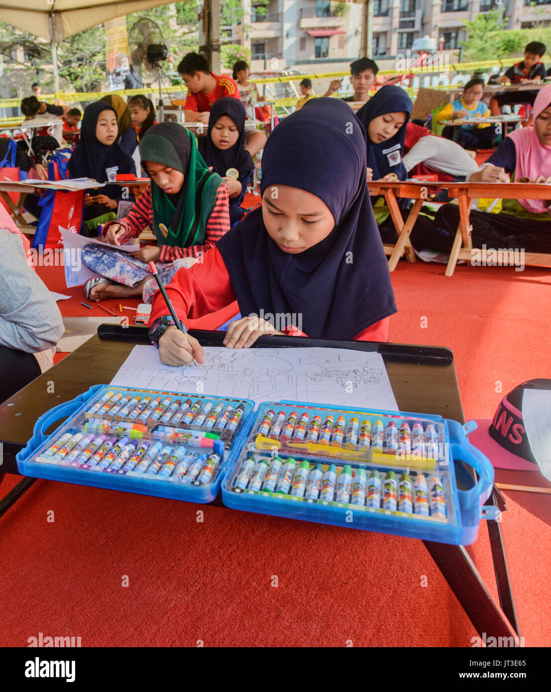 Girls drawing artwork, Malacca, Malaysia Stock Photo - Alamy