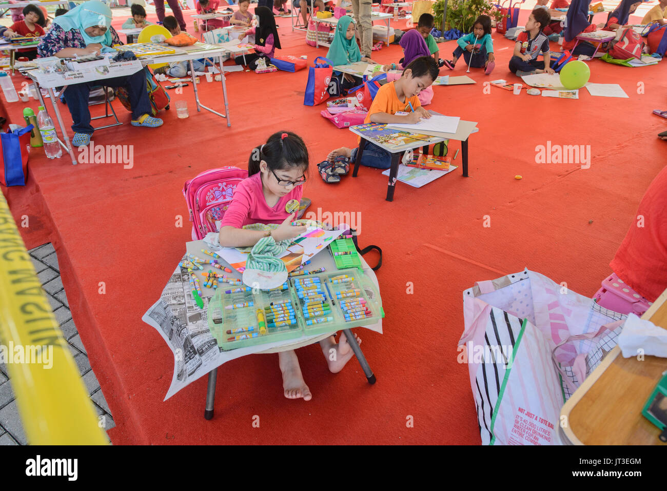Girls drawing artwork, Malacca, Malaysia Stock Photo - Alamy
