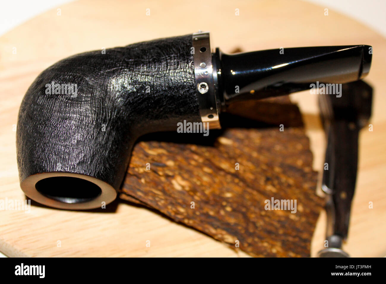 Handmade briar pipe and tobacco Stock Photo - Alamy