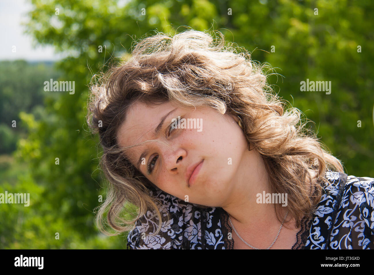 Portrait of a beautiful woman thinking and looking sad Stock Photo - Alamy