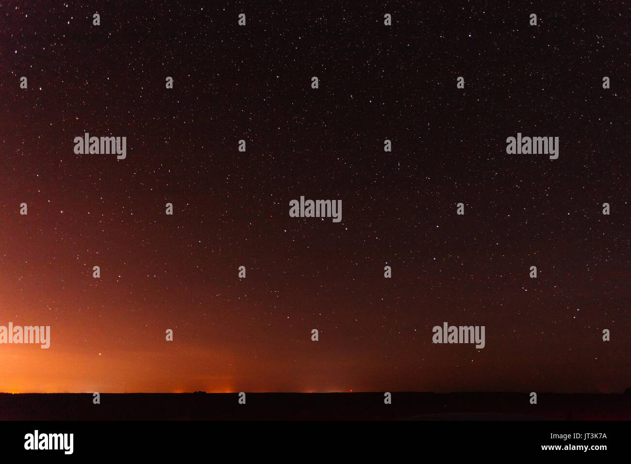 Night Starry Sky Over Yellow Sunset Or SunriseLights. Night Glowing ...