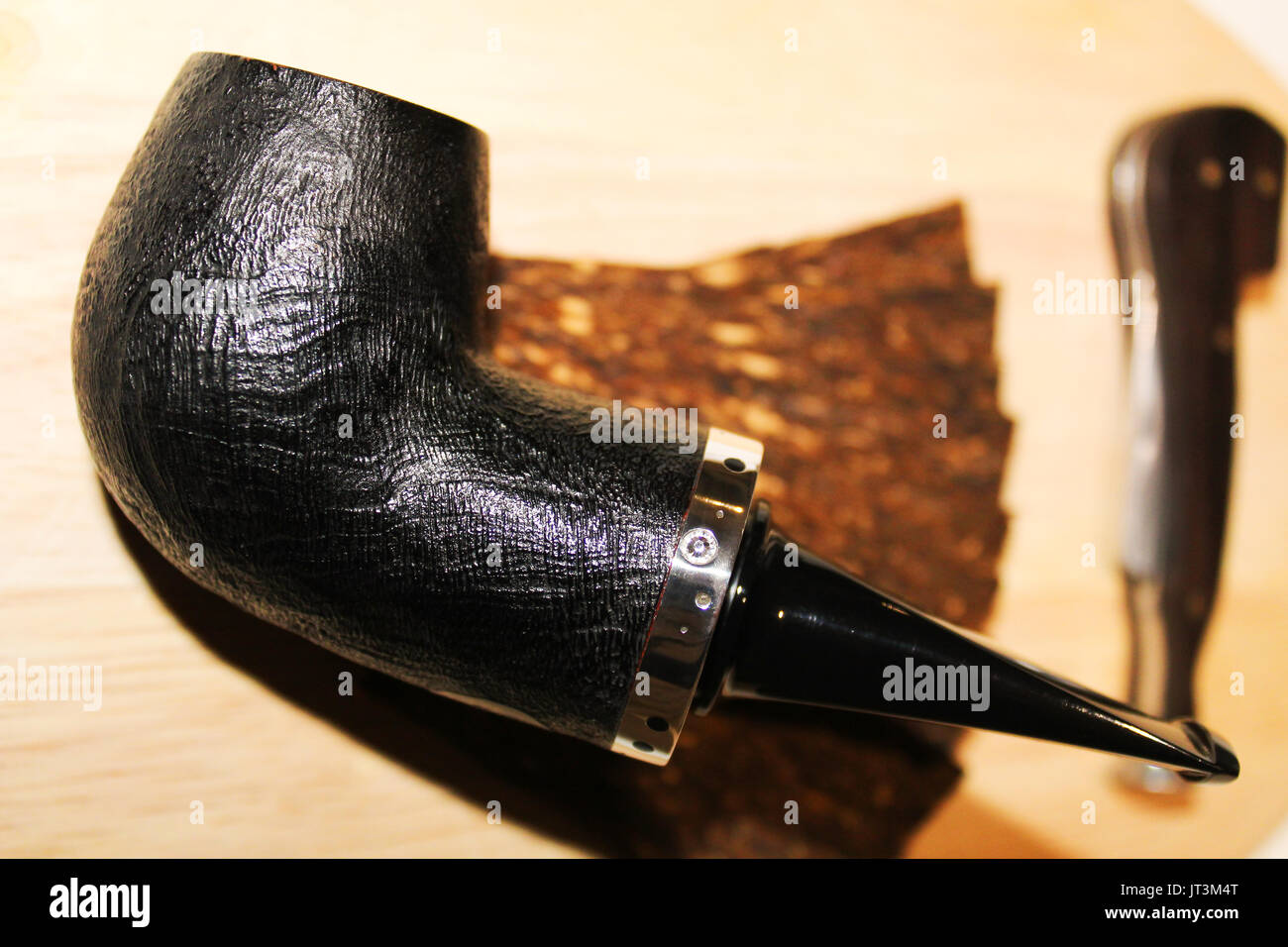 Handmade briar pipe and tobacco Stock Photo - Alamy
