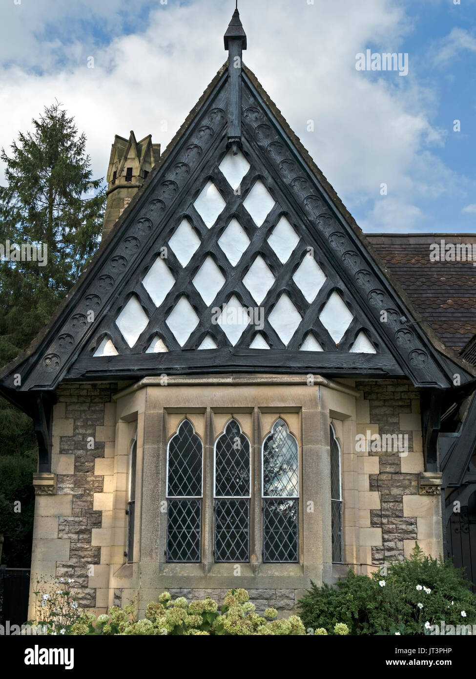 Ornate wooden lattice work and gables of Ilam Gatehouse Lodge, Ilam ...