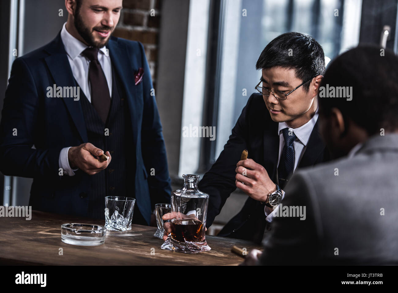 Rich men smoking cigars hi-res stock photography and images - Alamy