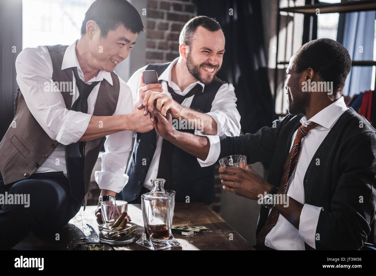 happy colleagues spending time together after work Stock Photo - Alamy
