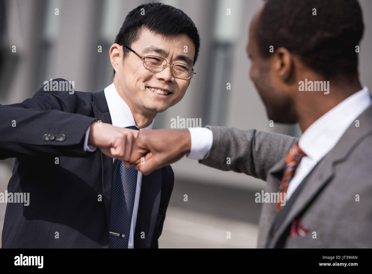Men celebrating in suits hi-res stock photography and images - Alamy