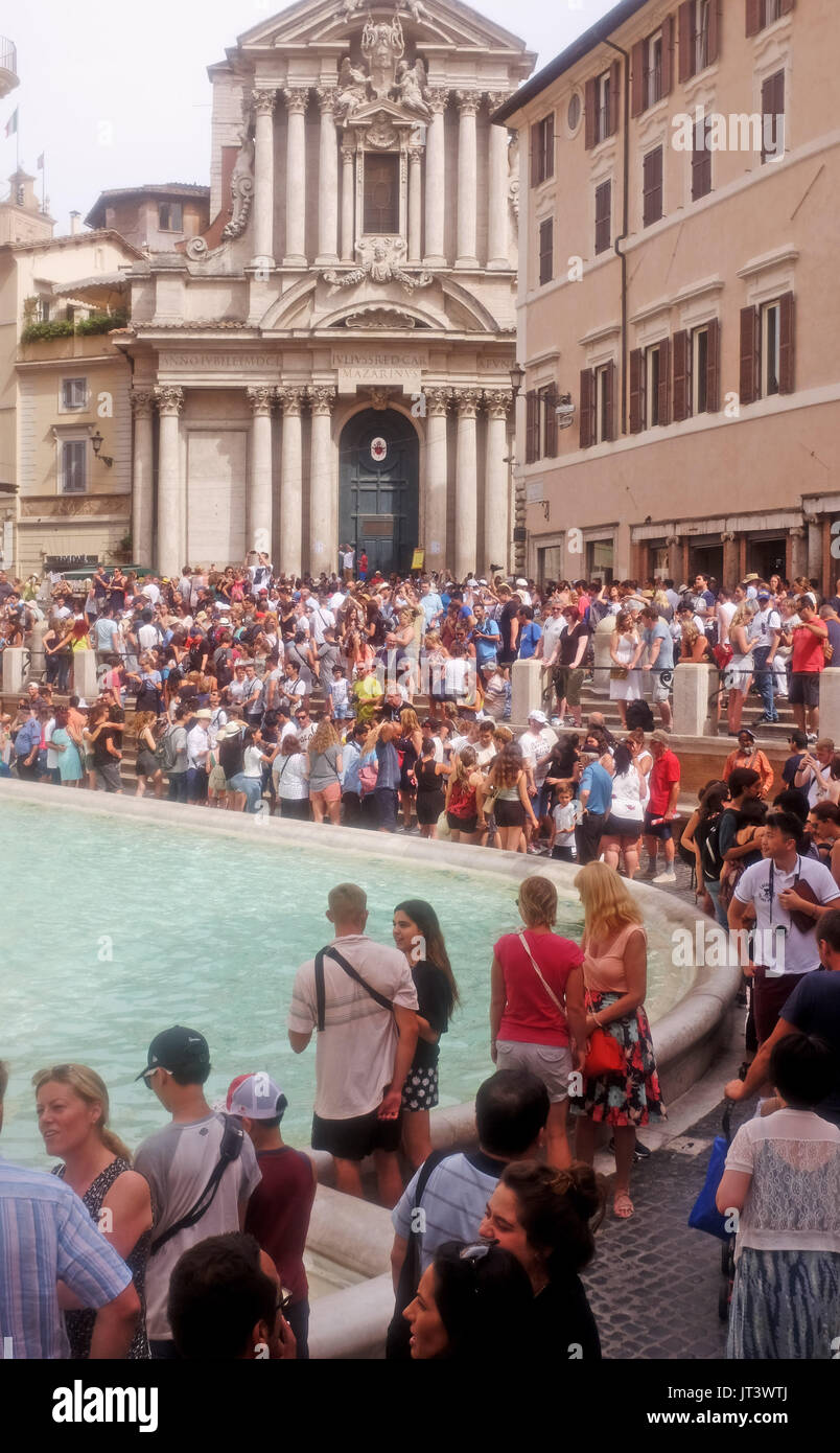 Rome Italy July 2017 - Tourists crowd around the Trevi Fountain ...