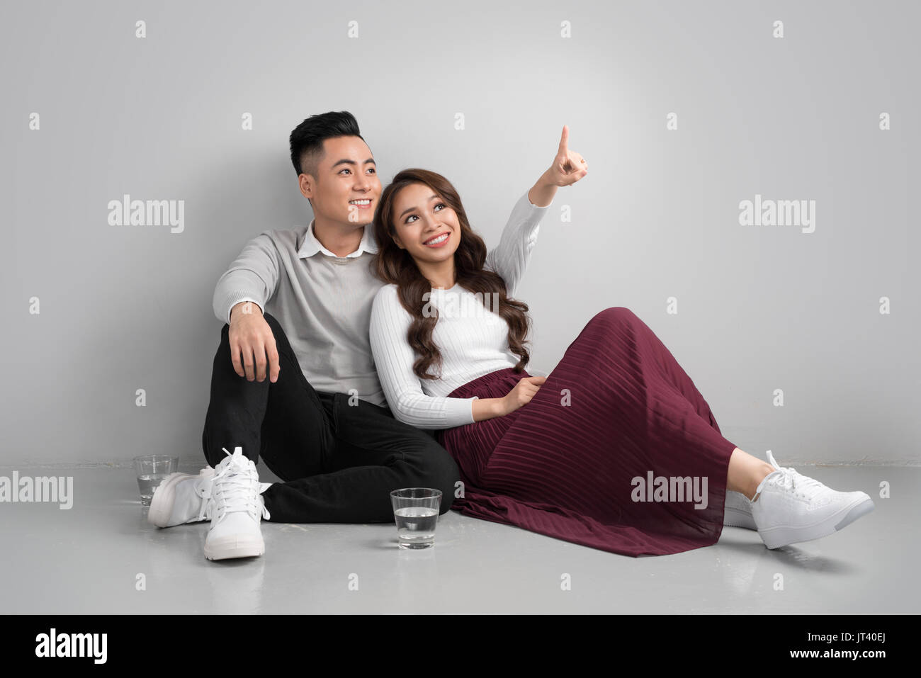 Leaning against wall sitting hi-res stock photography and images - Alamy