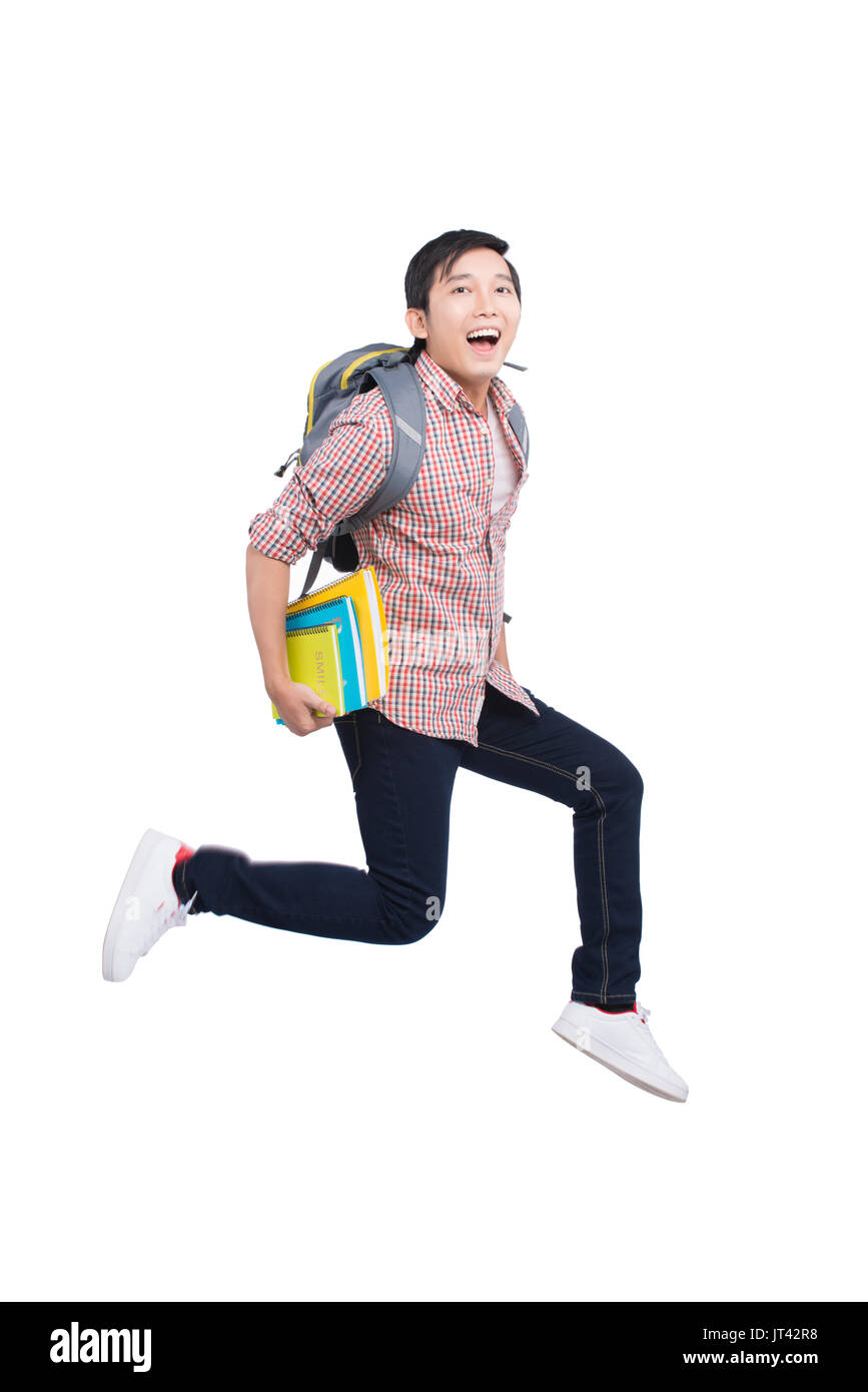 Jumping asian man happy excited on white background Stock Photo - Alamy