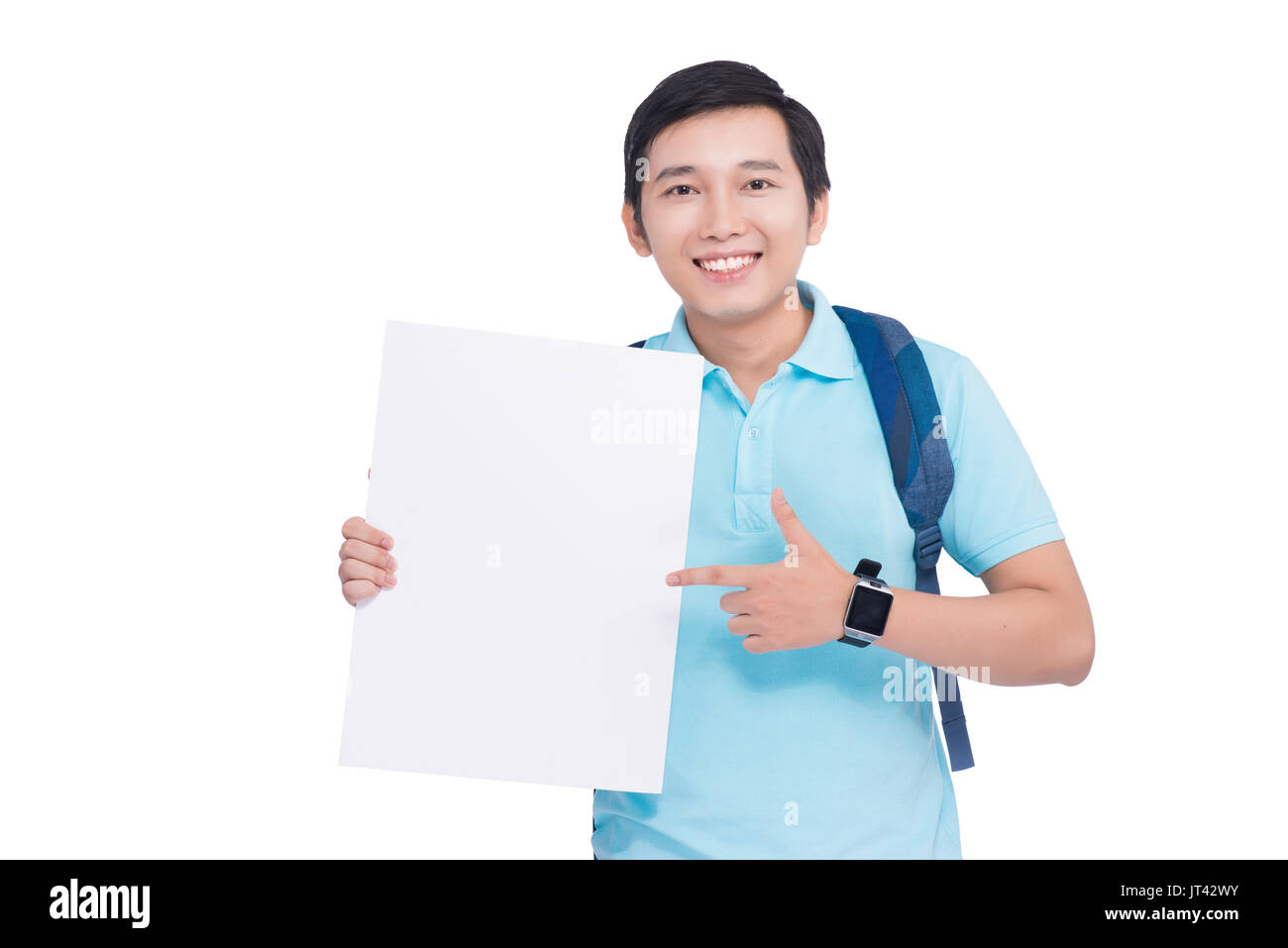 Cheerful student holding educational materials and pointing to blank ...
