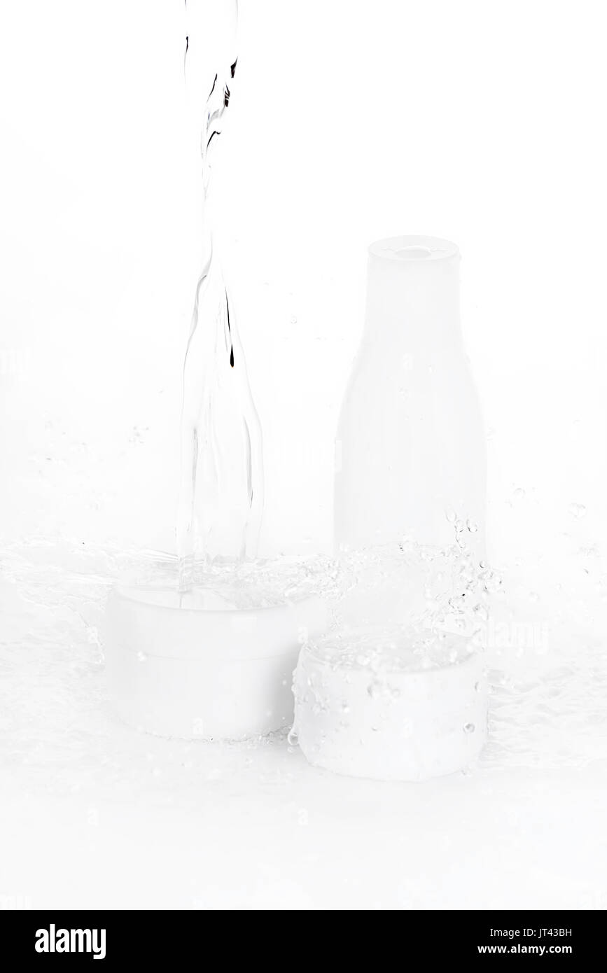 water drops falling on bottle and boxes isolated on white Stock Photo ...