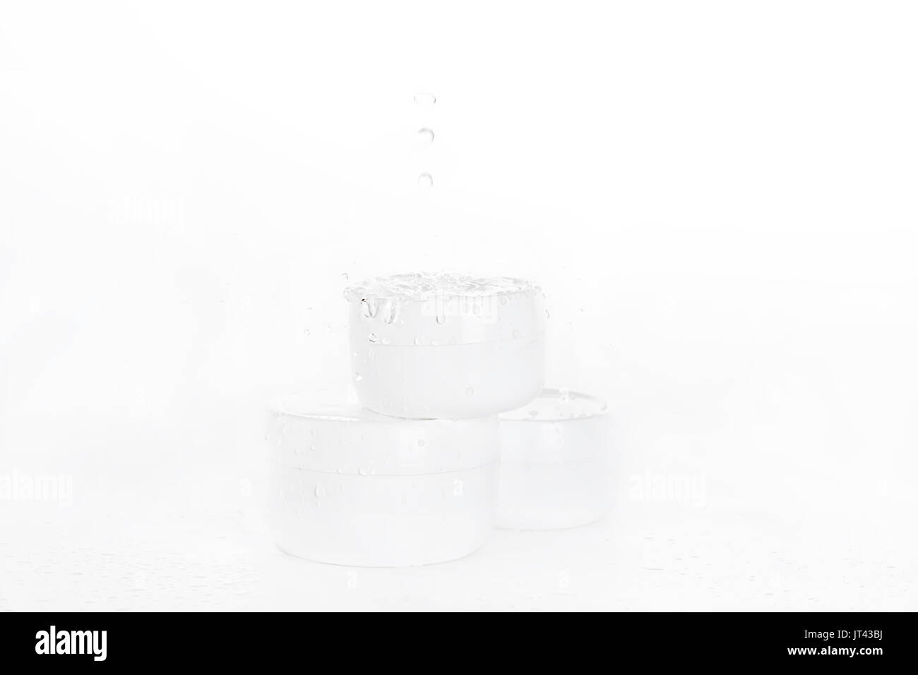 water drops falling on heap of boxes isolated on white Stock Photo - Alamy