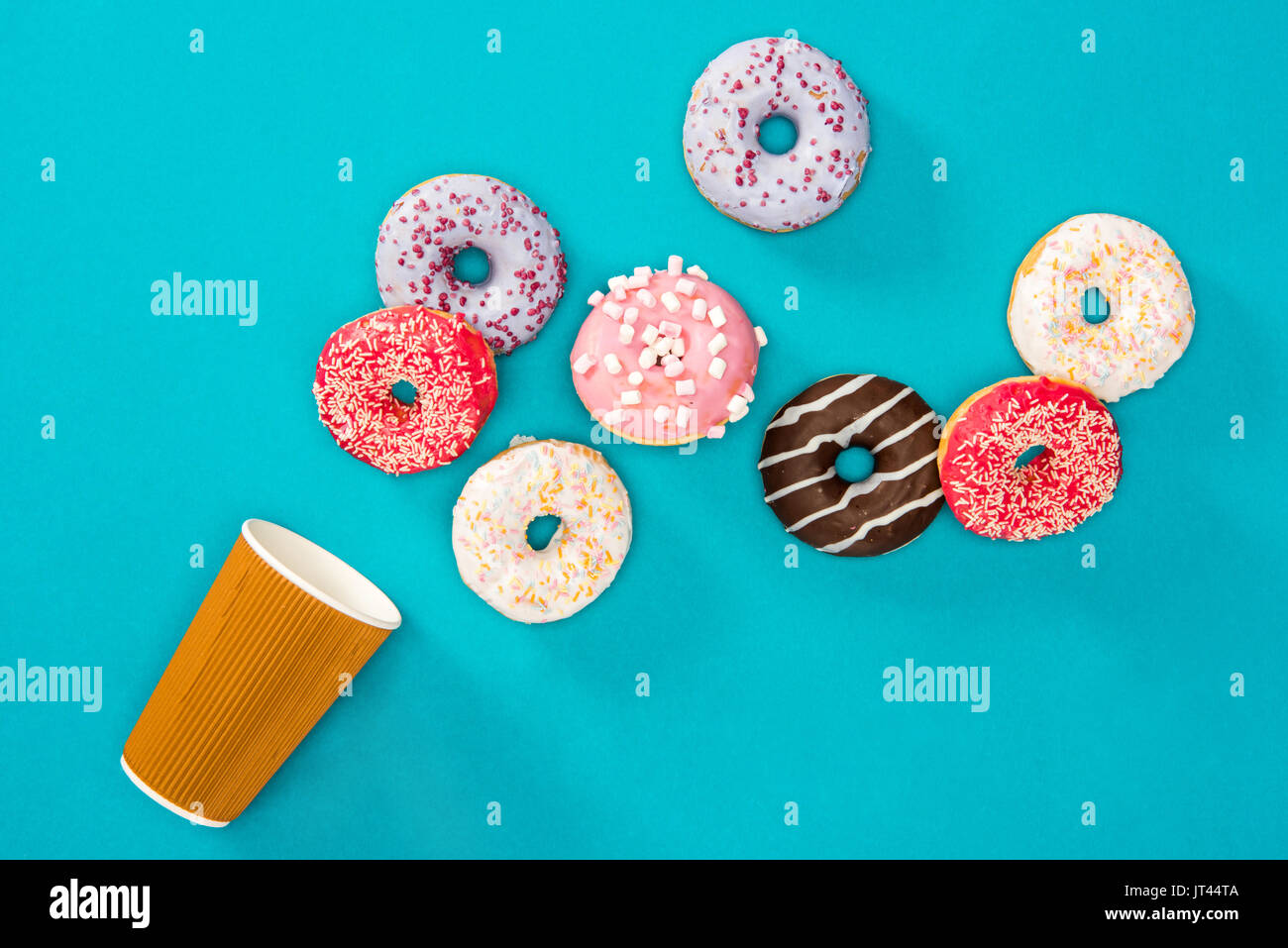 Overhead view of several donuts with various colorful glaze scattered ...