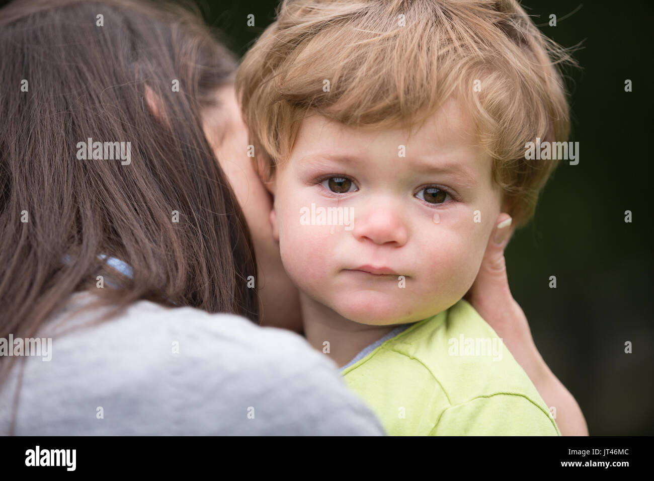 Son hug mother unhappy hi-res stock photography and images - Alamy