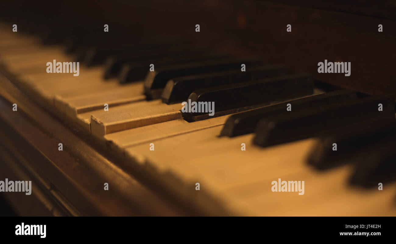 Old pianos old color tone as background Stock Photo - Alamy