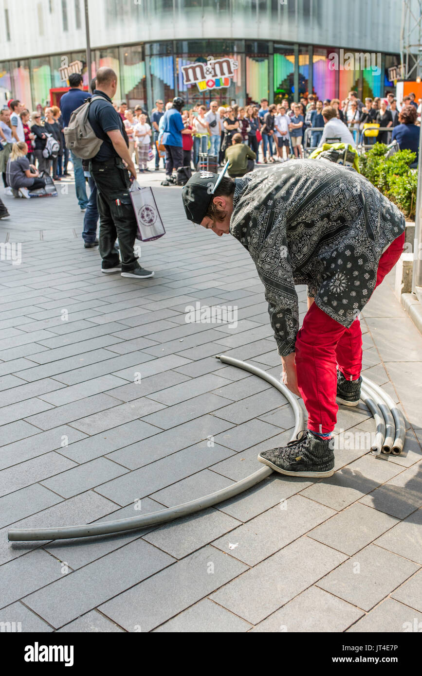Street performer preparing for his show in Leicester Square, London, UK ...