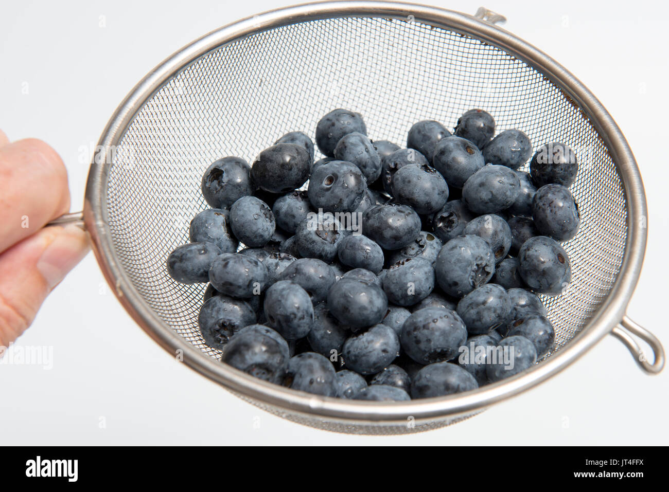 Berries in sieve hi-res stock photography and images - Alamy