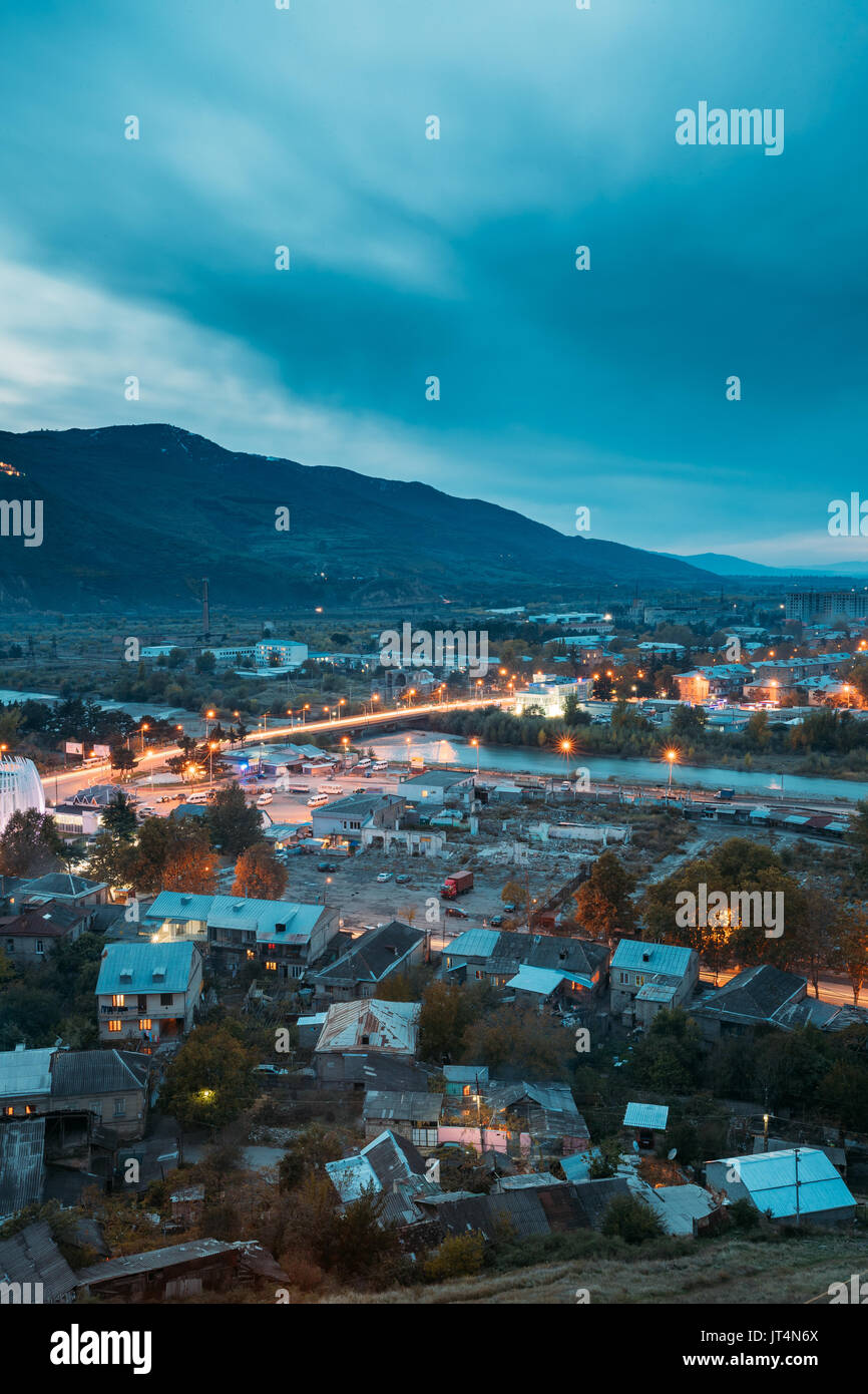 Gori, Shida Kartli Region, Georgia. Cityscape In Bright Yellow Evening ...
