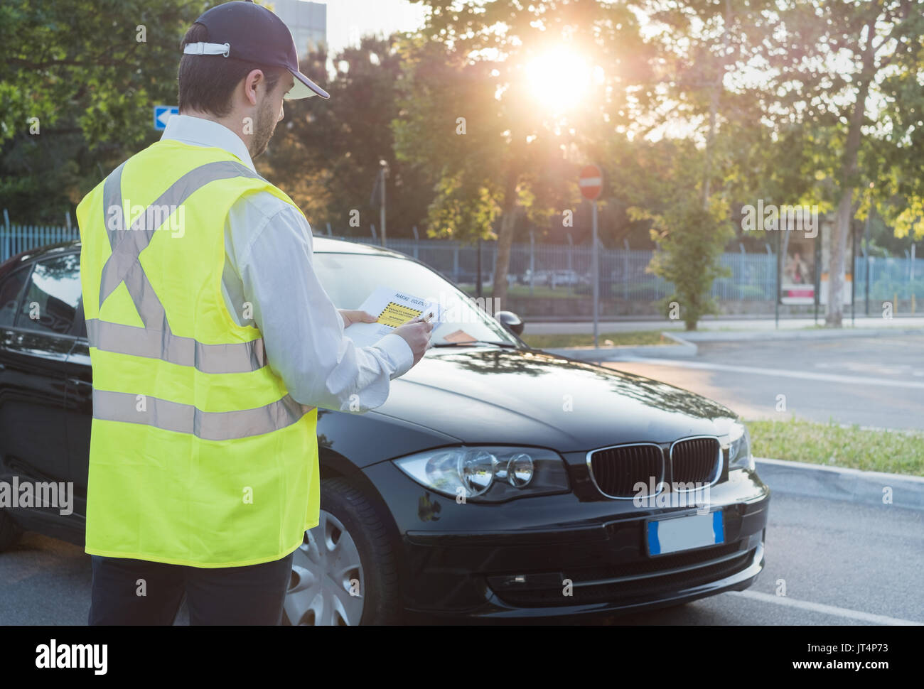 Policeman giving ticket hi-res stock photography and images - Alamy