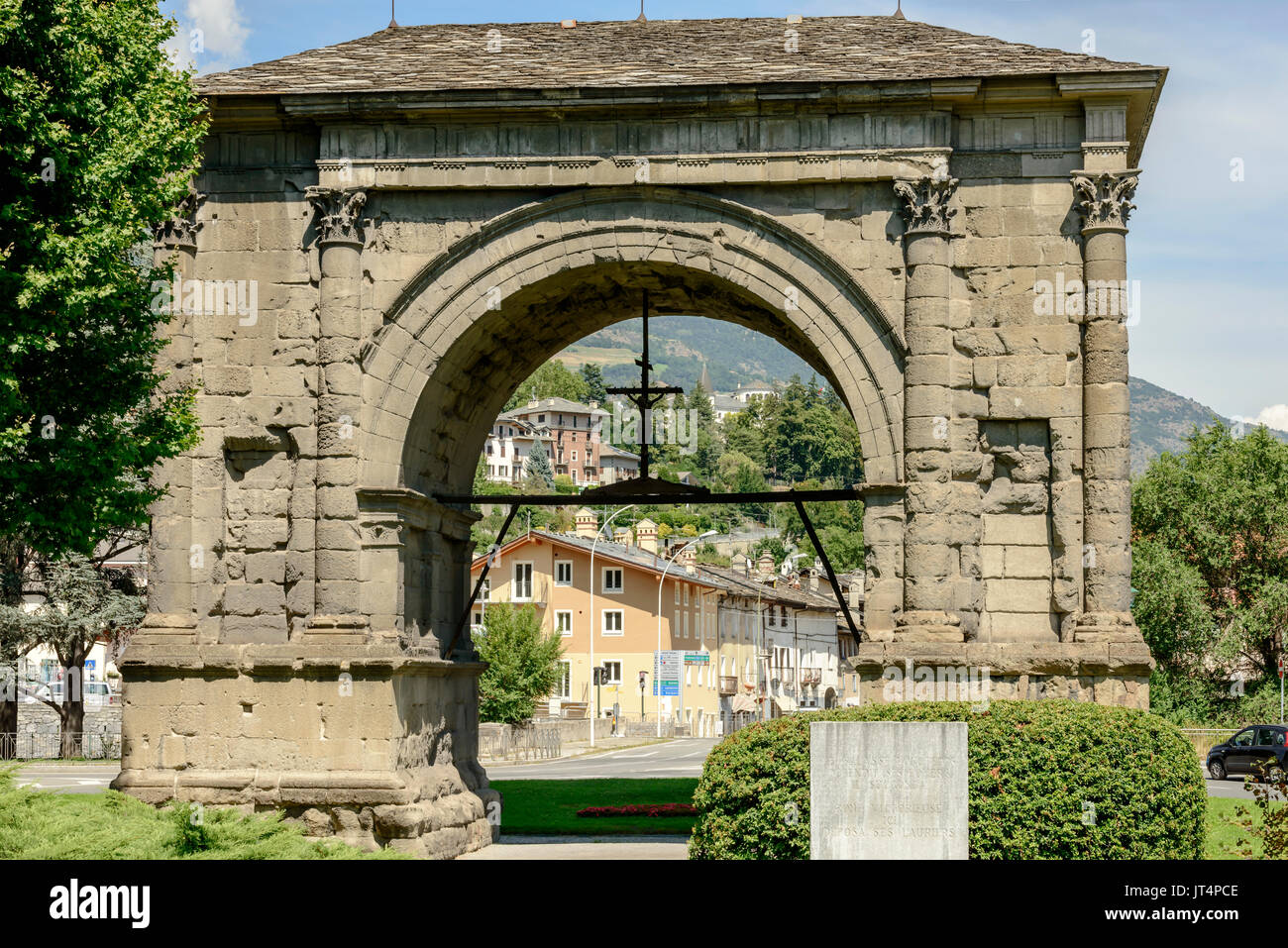 Roman monumental stone arch, shot on a bright summer day at Aosta ...