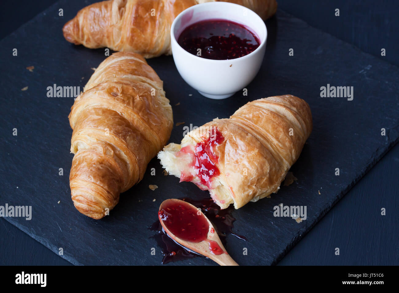 Croissant and raspberry jam Stock Photo - Alamy