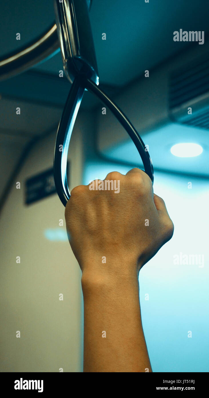 Big black color train handle and hand grabing for safety and travel by ...