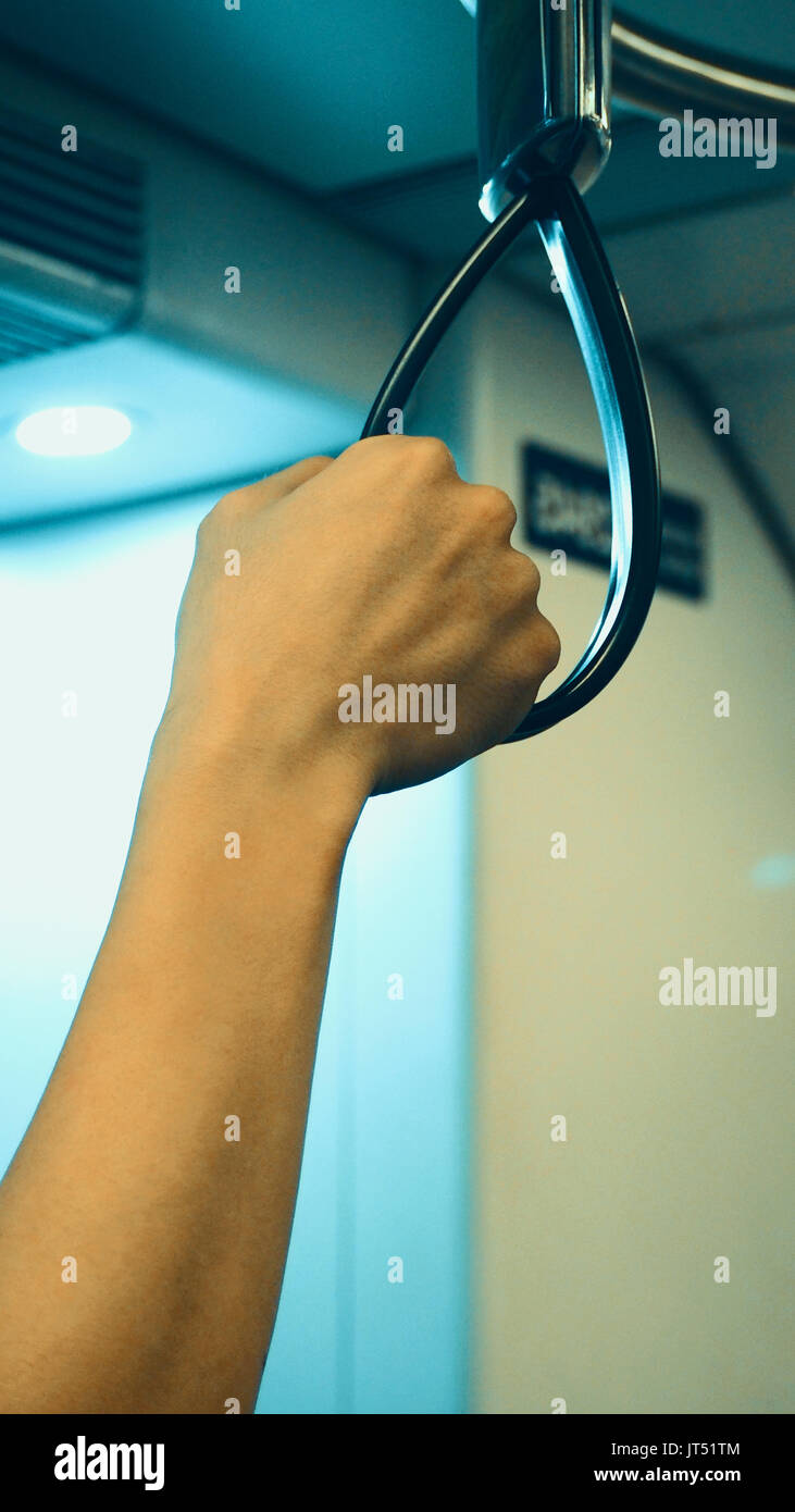 Big black color train handle and hand grabing for safety and travel by ...