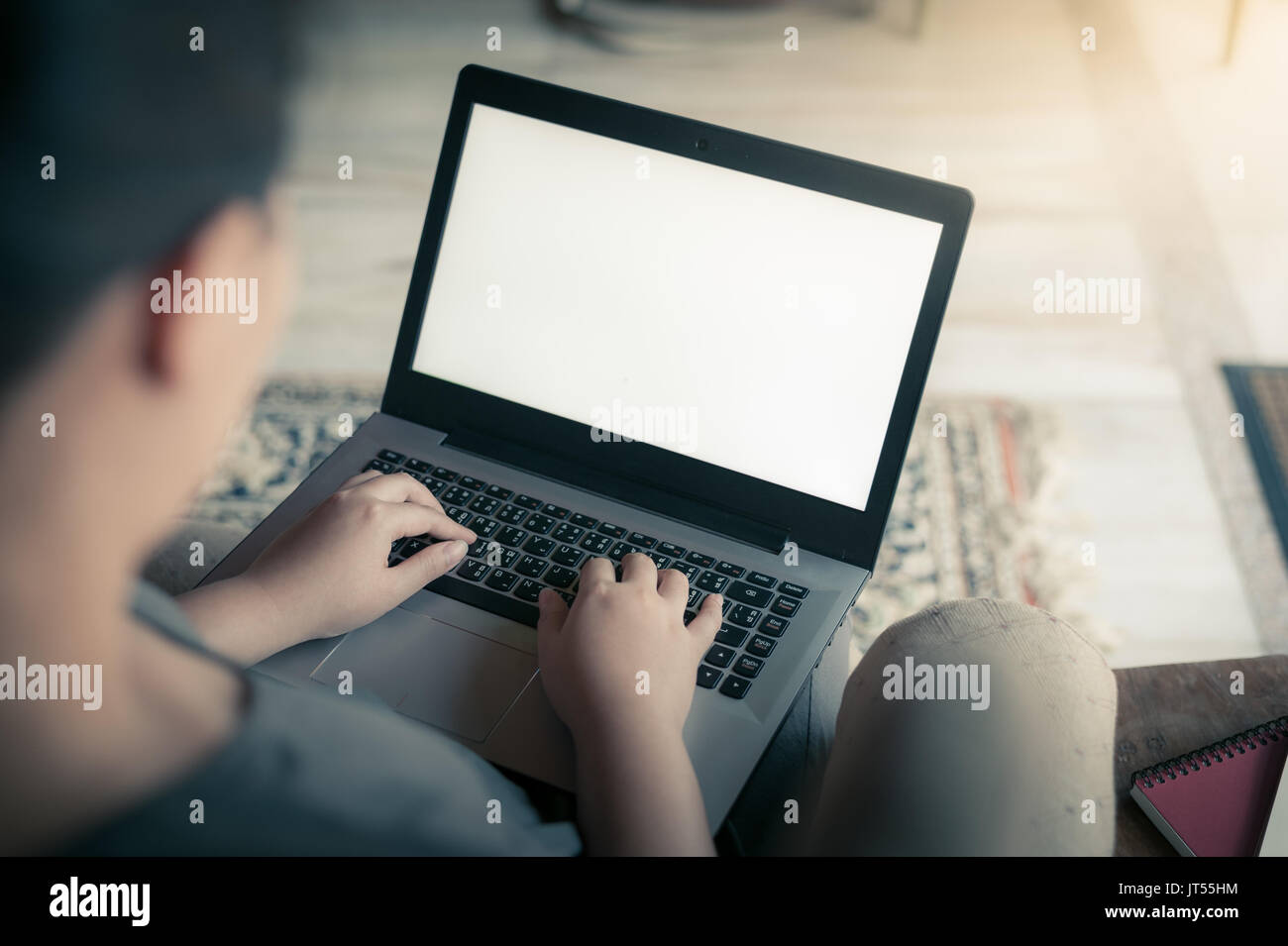 Woman typing on laptop computer keyboard while using internet for ...