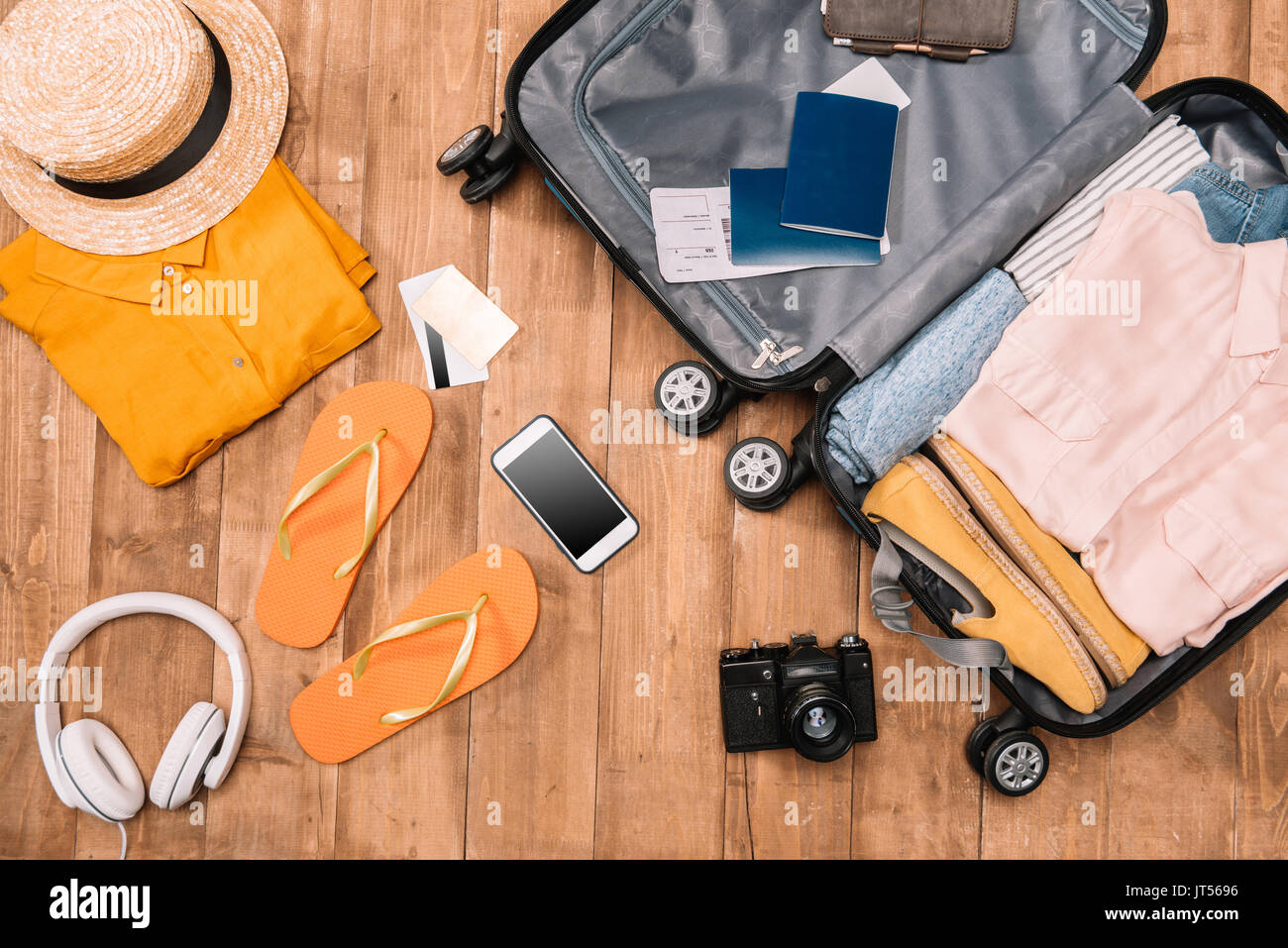 Ready for travel concept. Top view of essentials for tourist with ...