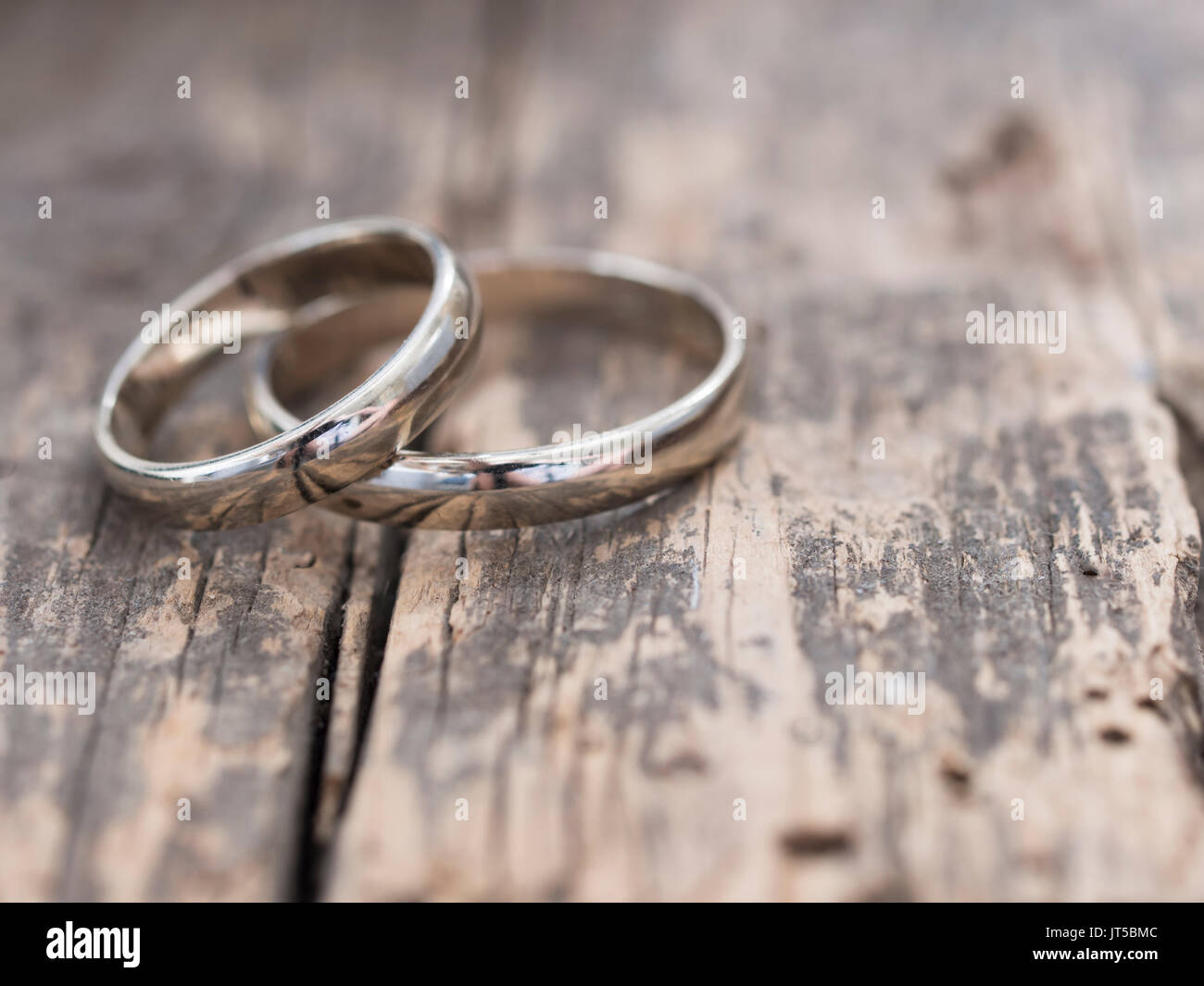 golden wedding rings in decorative arrangement Stock Photo - Alamy