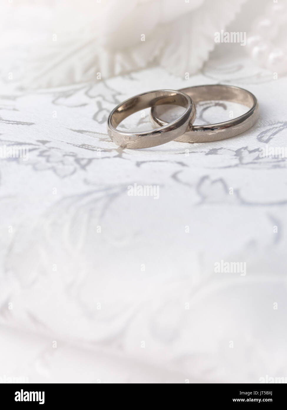 golden wedding rings in decorative arrangement Stock Photo - Alamy